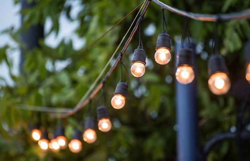 8 Tips on How to Hang String Lights In Backyard Without Trees